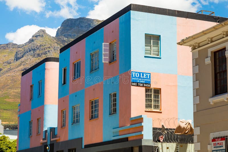 Colourful Old Block of Flats in City with Mountain in the Background ... Colourful Old Block of Flats in City with Mountain in the Background ...