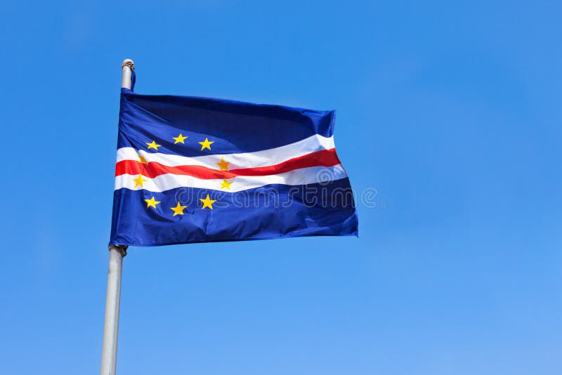 Cape Verde Flag Waving on Wind Over a Blue Sky Stock Photo - Image of ...
