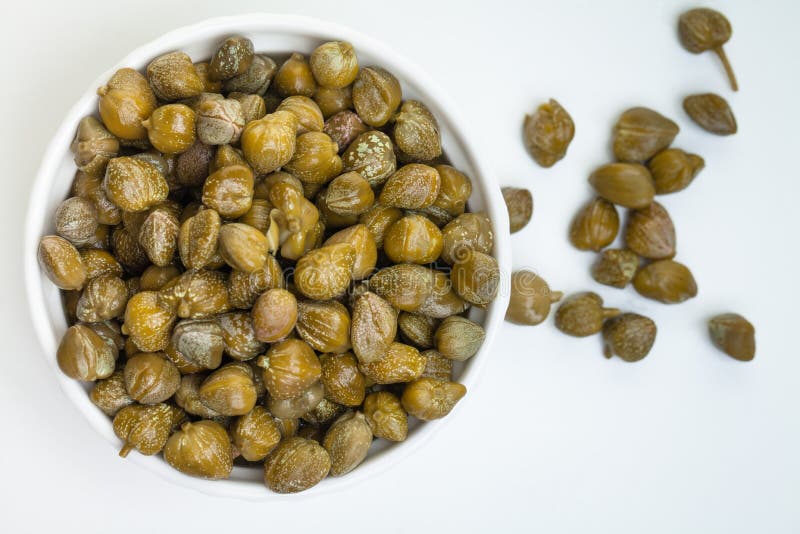 Capers with Green Leaves and Flower on White Stock Image - Image of ...