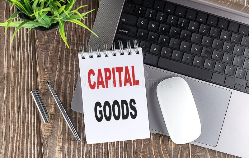 CAPITAL GOODS Text on Notebook with Laptop, Mouse and Pen Stock Image ...