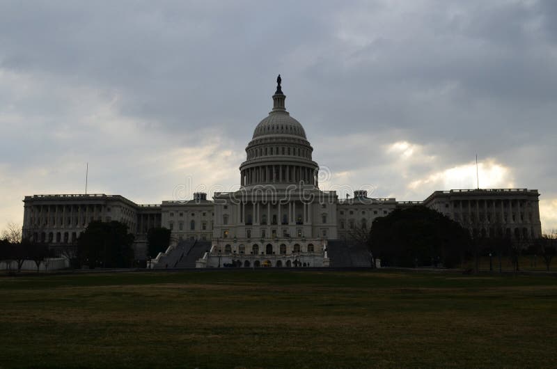 Capitol Hill at Dawn with the Sun Rising Behind the Capitol Building ...