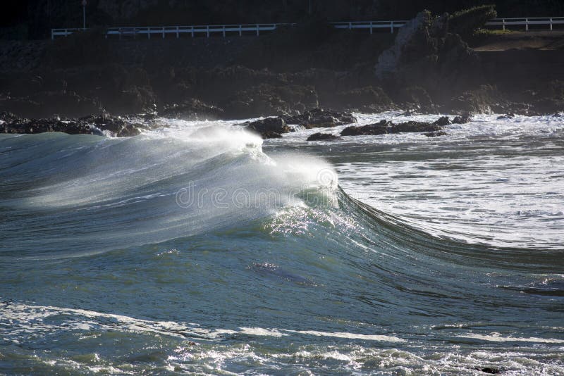 Capped stock image. Image of spray, rocks, wave, island - 31536879