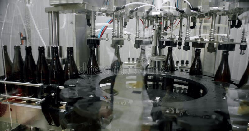 Capping Process of Full Beer Bottles.Machine for Capping Bottles ...