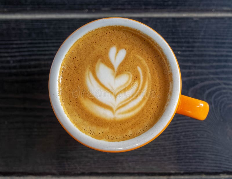 Cappuccino Art Coffee Cup Top View on a Lack Veined Table Surface ...