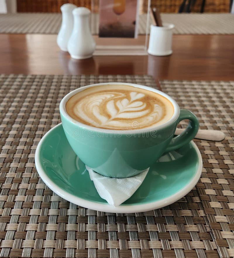 A Cappuccino Coffee Served in a Cup on a Brown Table in a Restaurant ...