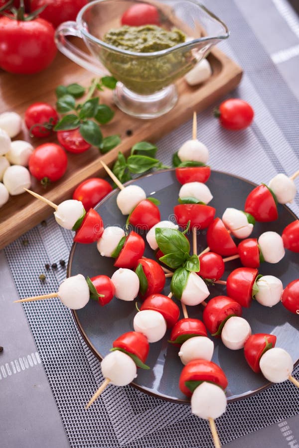 Caprese Salad - Mini Mozzarella Cheese in Glass Bowl, Tomato and Basil ...