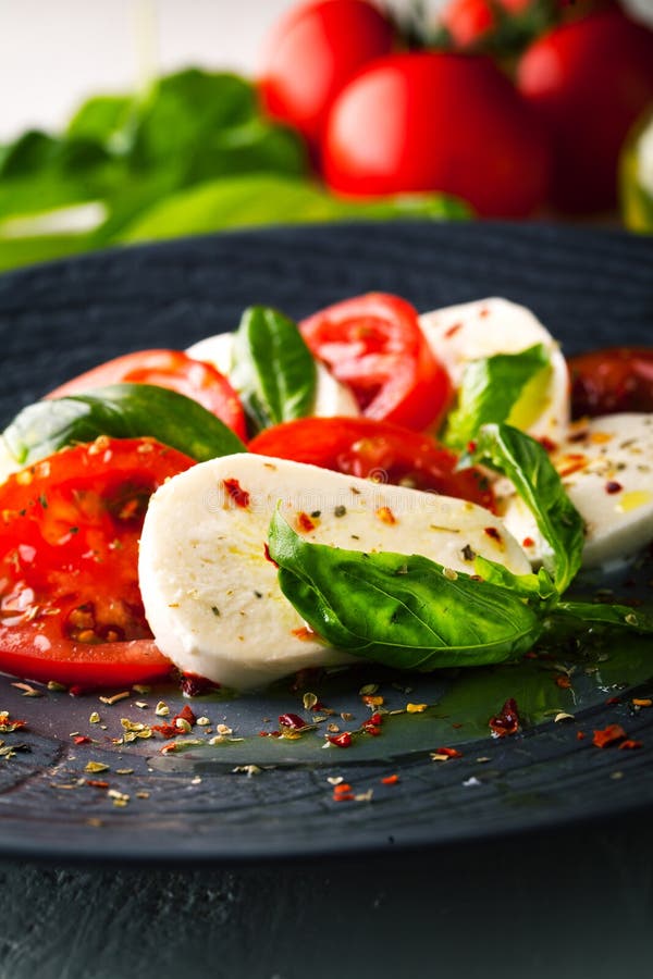 Caprese Salad with Mozzarella, Fresh Tomato and Basil Stock Photo ...