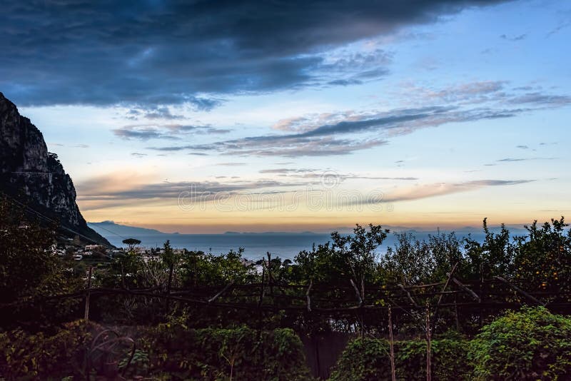 Capri Island Sunset with Scattered Clouds Stock Photo - Image of ...