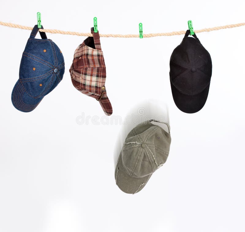 Caps on a Clothesline stock photo. Image of group, green - 10597466