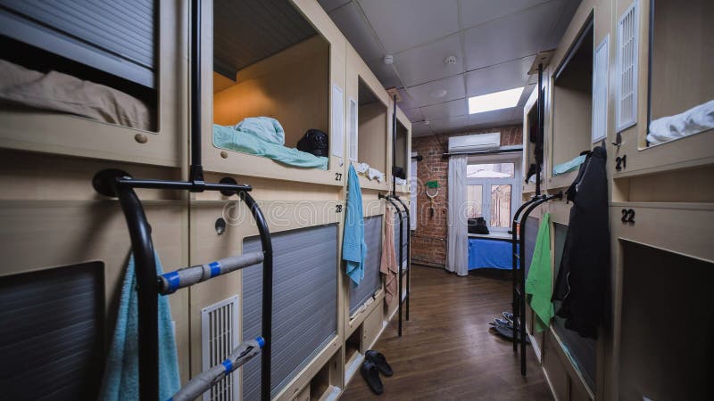 Capsule Hotel Room Showing Individual Sleeping Boxes with Ladders ...