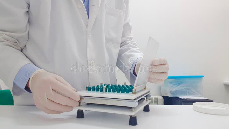 Capsule making machine stock image. Image of equipment - 143727497