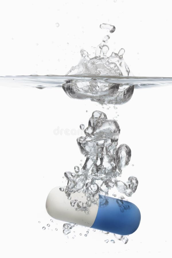 Capsule Pill Sinking in Water Close-up Stock Photo - Image of single ...