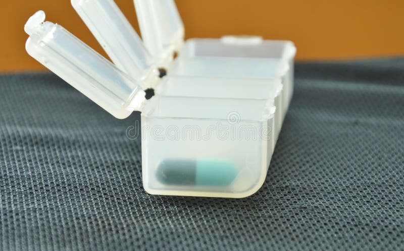 Capsule in Plastic Cartridges on Black Fabric Stock Image - Image of ...