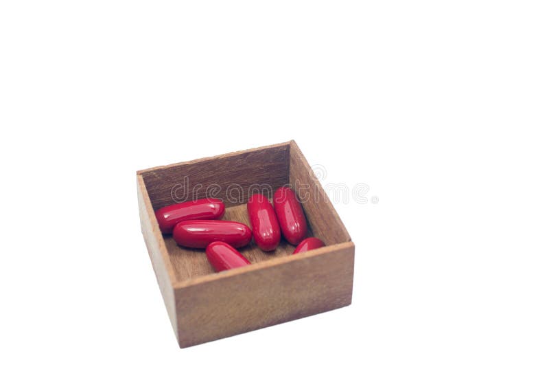 Capsule Red in Little Casket Wood Stock Photo - Image of capsulered ...