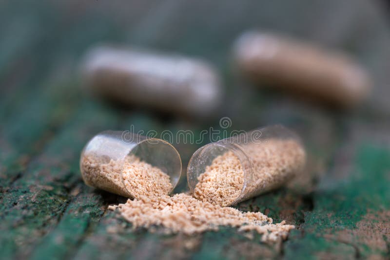 Pharmacy -Capsule Opened in Half Pouring Its Contents. Stock Photo ...