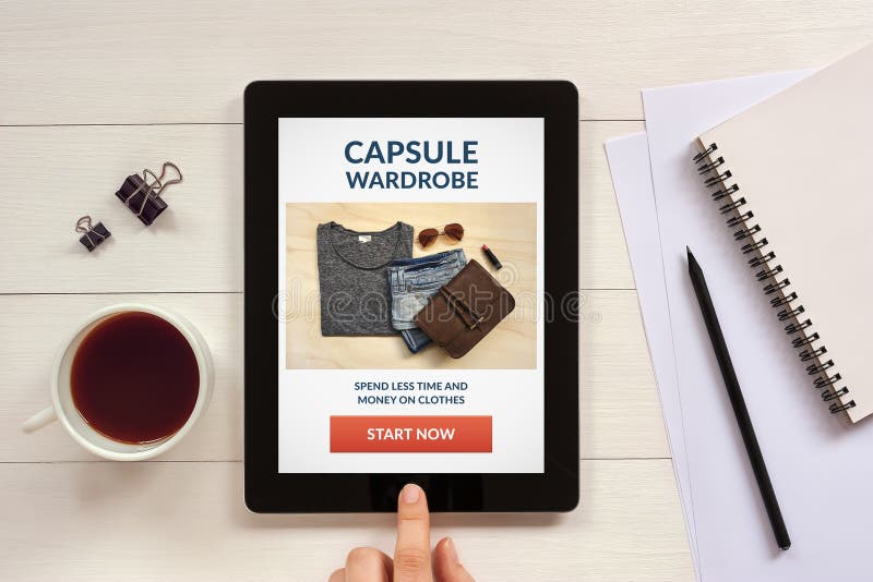 Capsule Wardrobe Concept on Tablet Screen with Office Objects Stock ...