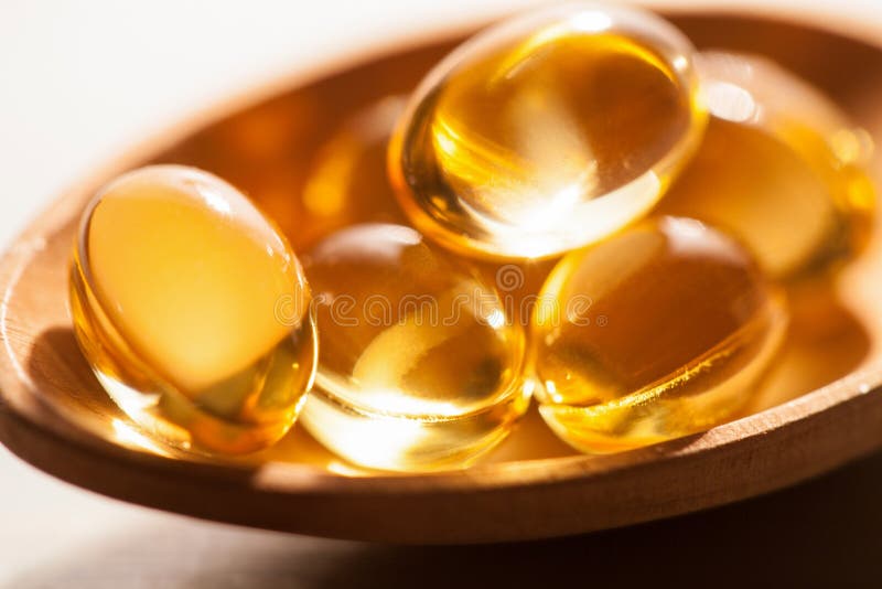 Capsules of a fish fat stock image. Image of fish, wooden - 102932325