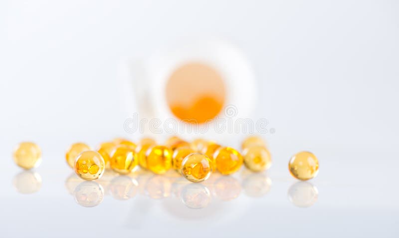 Capsules of Fish Oil Spilled Out Container Stock Photo - Image of ...