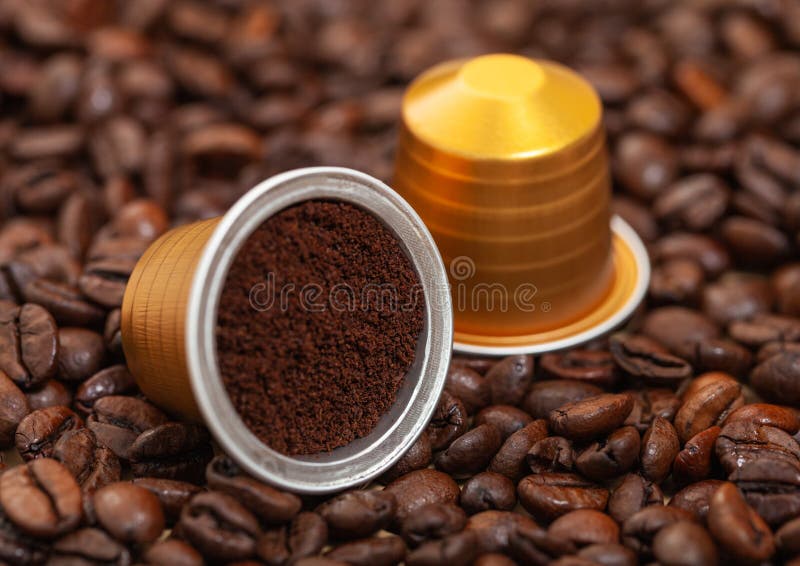 Capsules with Ground Coffee on Fresh Raw Aroma Beans Stock Photo ...