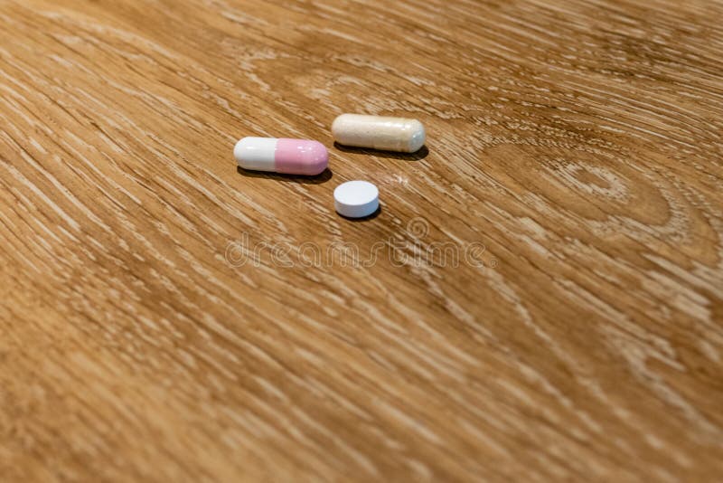 Capsules and pill on table stock photo. Image of pill - 157135022