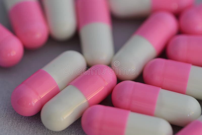 Capsules Roses Et Blanches Avec Fond Blanc Image stock - Image du ...