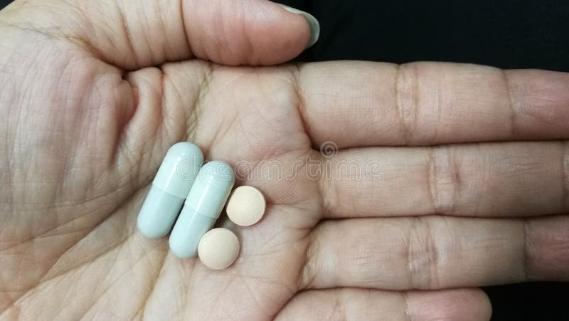 Capsules and Tablets Medicine in Hand Stock Photo - Image of capsules ...