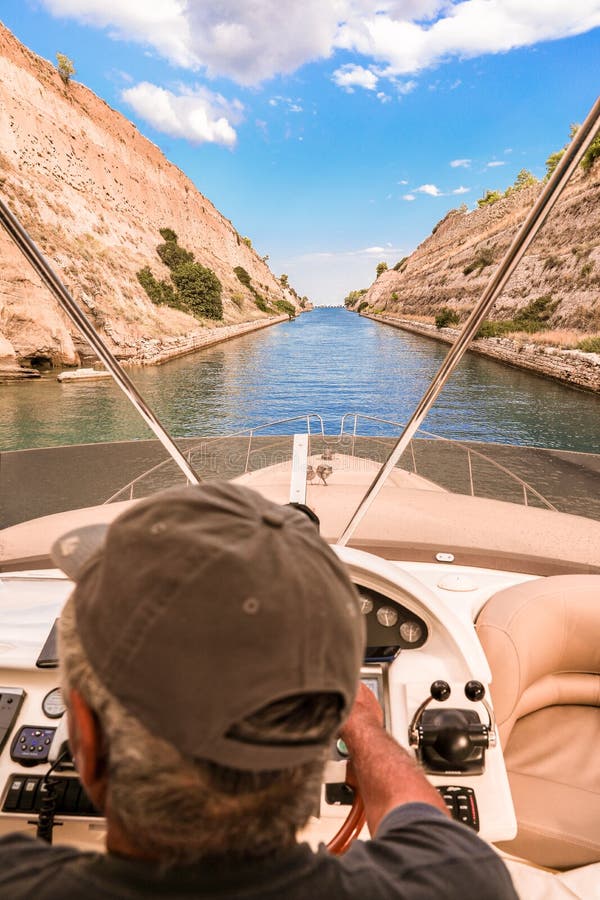 Captain Controls the Boat during the Passage through the Corinth Canal ...