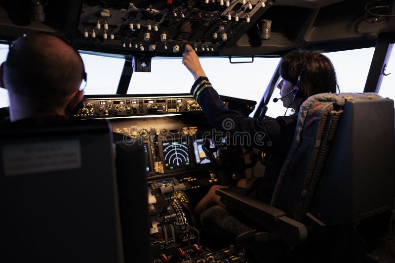 Captain and Copilot Using Dashboard Command To Takeoff with Plane Stock ...
