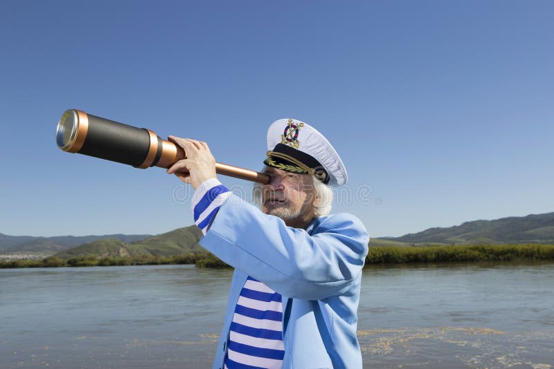 Captain Looks through a Telescope Stock Image - Image of marine ...