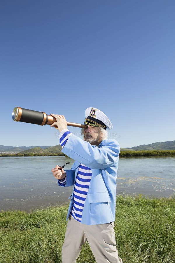 Captain Looks through a Telescope Stock Image - Image of marine ...