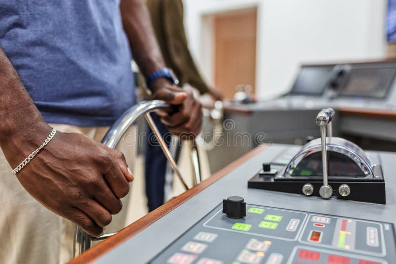 Captain`s Hands at the Helm of a Boat.Captain`s Hands at the Helm of a ...