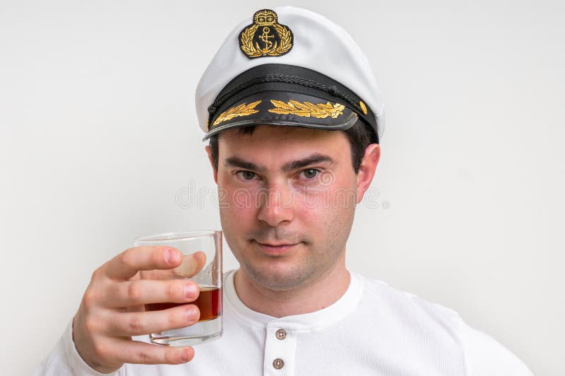 Captain with Sailor Cap Holding Glass of Whisky Stock Photo - Image of ...