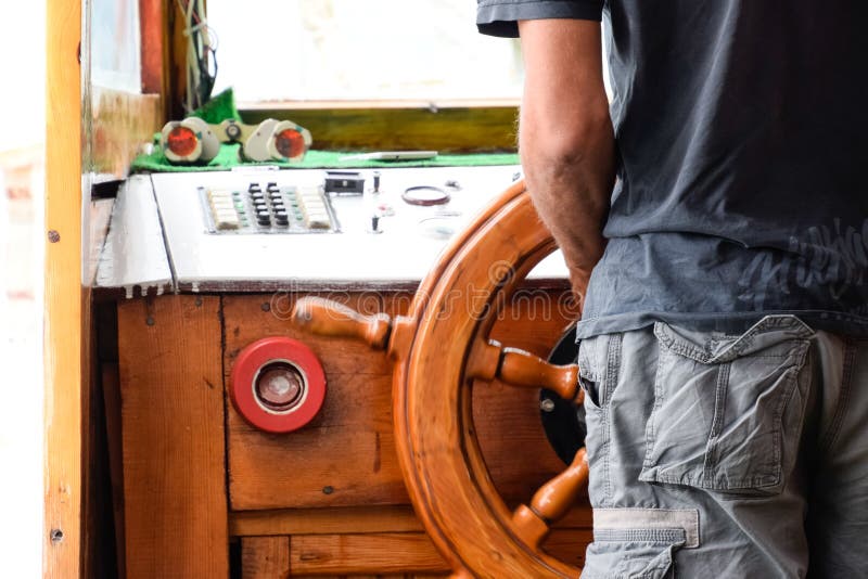 The Captain of the Ship at the Helm Stock Photo - Image of manage ...