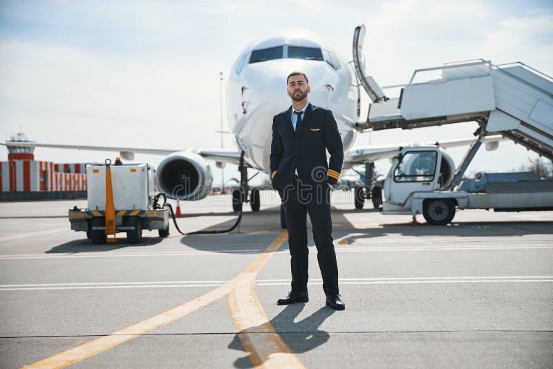 Handsome Pilot Standing on Airstairs To Plane Stock Image - Image of ...