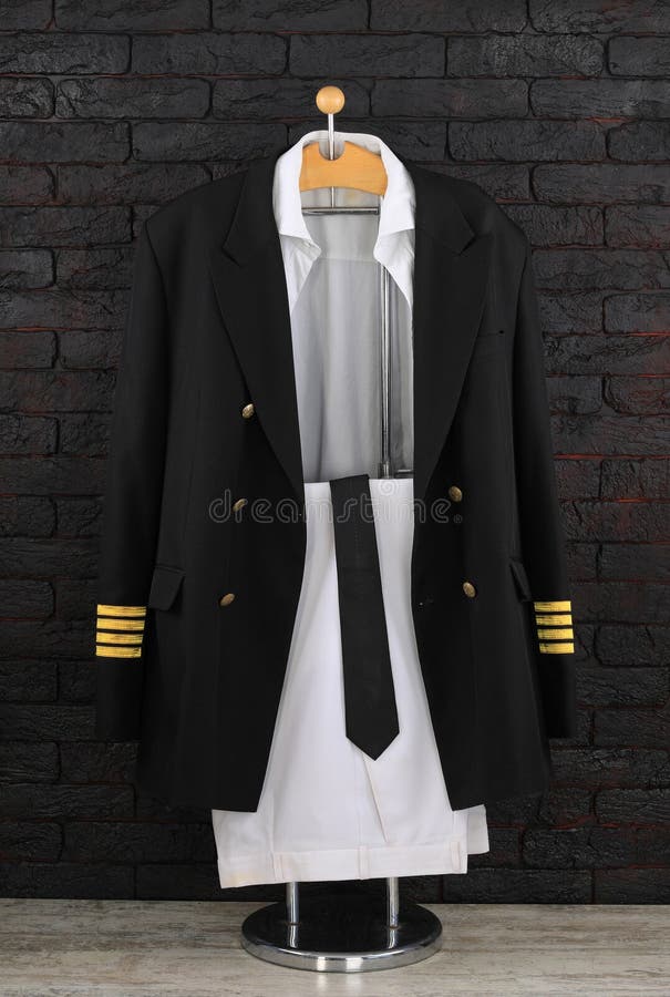 Captain uniform on hanger stock photo. Image of aircraft - 332545342