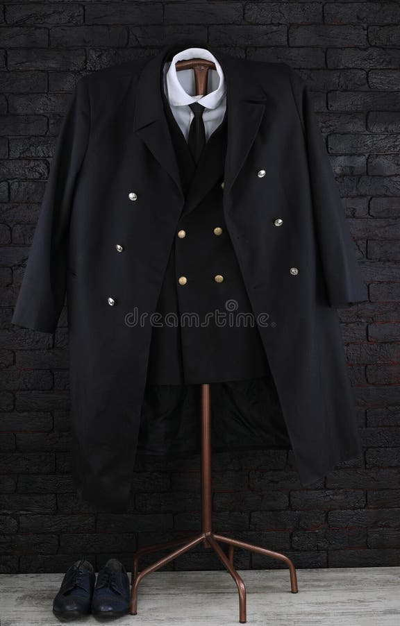 Captain uniform on hanger stock image. Image of cabin - 332544531