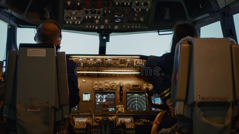 Captain and Copilot Pushing Dashboard Buttons To Start Engine Stock ... Captain and Copilot Pushing Dashboard Buttons To Start Engine Stock ...