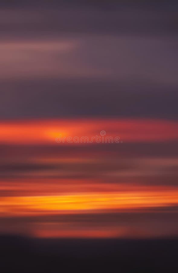 Abstract Blurred Background of a Vibrant Sunset Over Natural Landscape ...