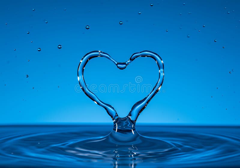A Captivating Heart-shaped Water Droplet Splash Against a Deep Blue ...