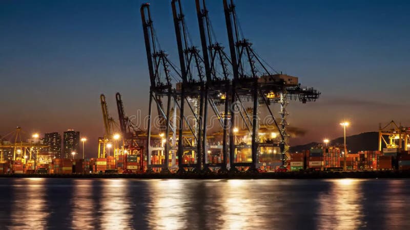 Nighttime Panorama of a Bustling Container Port with Illuminated Cranes ...