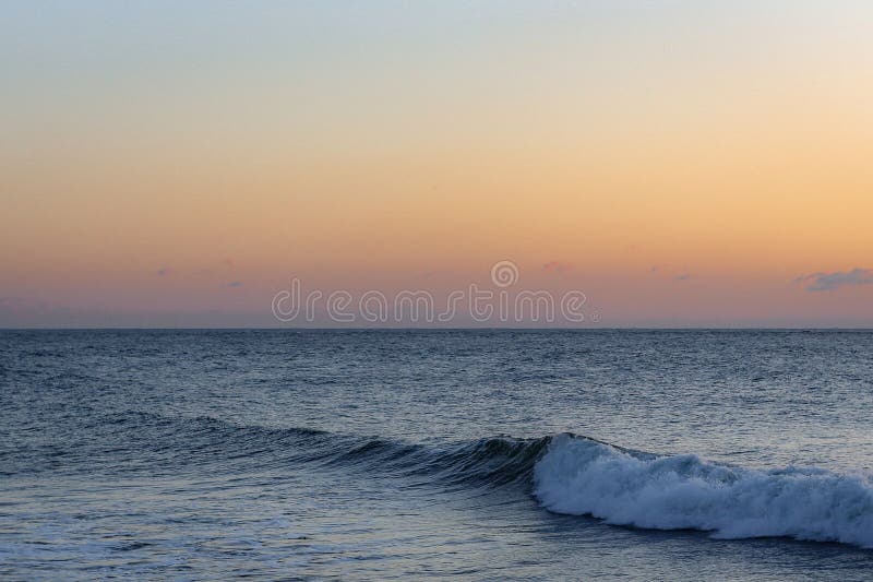 Captivating Image of a Calming Sunset with a Majestic Ocean Wave in the ...