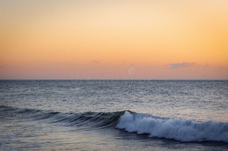Captivating Image of a Calming Sunset with a Majestic Ocean Wave in the ...