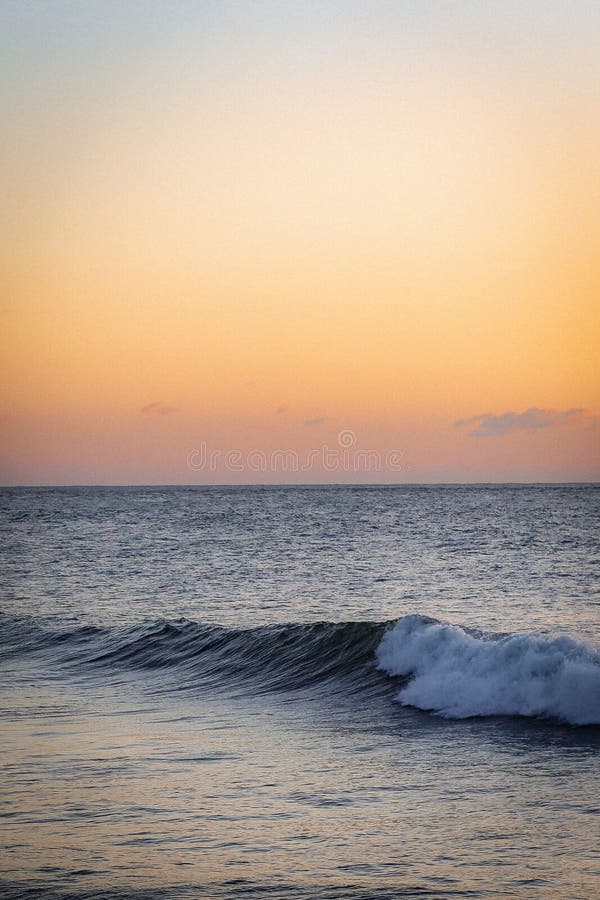 Captivating Image of a Calming Sunset with a Majestic Ocean Wave in the ...