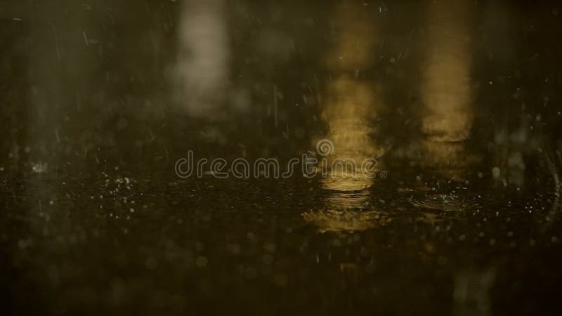 Raindrops on Wet Surface at Night Reflect Lights, Creating Dark ...