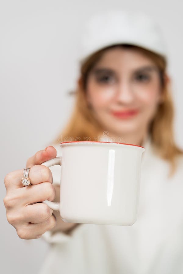 Captivating Mockup Image Capturing a Woman Presenting a White Blank Mug ...