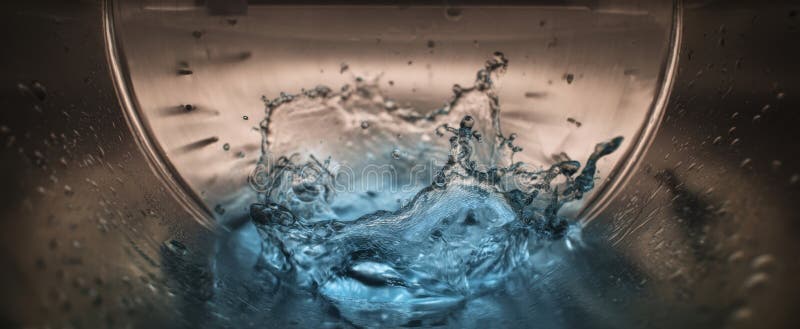 The Captivating Splash of Water Inside a Transparent Container AI ...