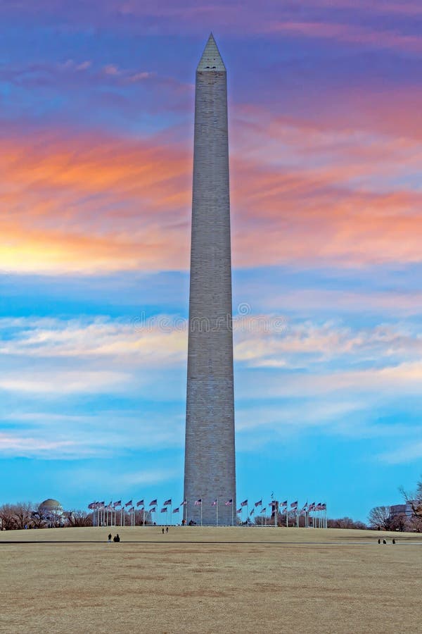 Captivating Sunset Behind the Washington Monument Surrounded by Flags ...