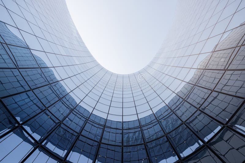 Glass Building with Grid Like Pattern, Reflective Surfaces, and Clear ...