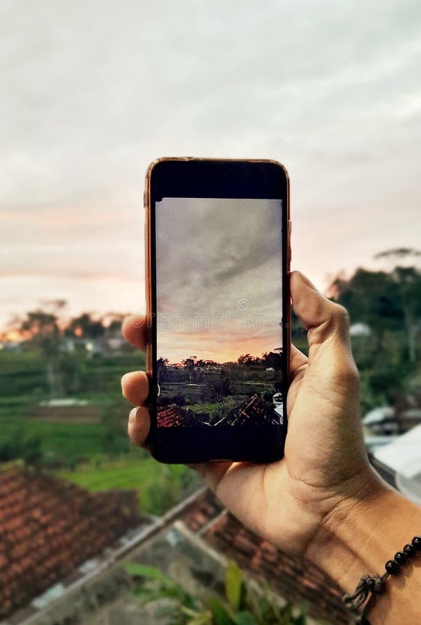 Capture the Sunset View with a DSLR Camera Standing on Standby Stock ...