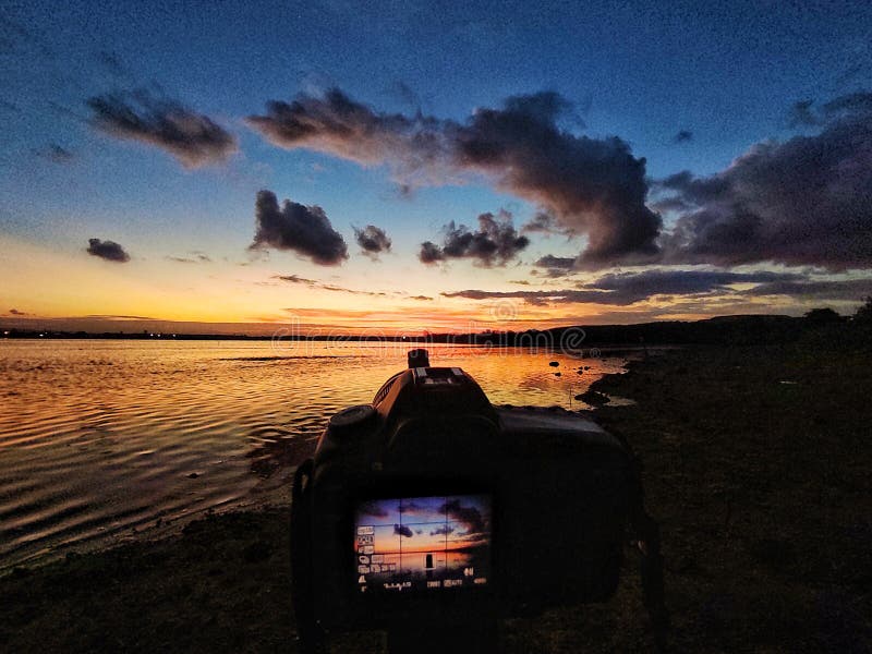 Capture the Sunset View with a DSLR Camera Standing on Standby Stock ...